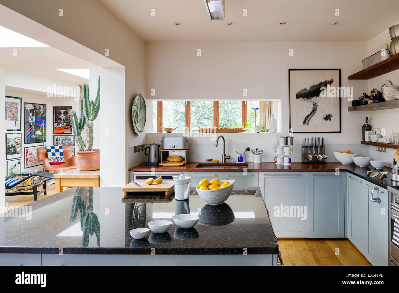 Light and airy open plan kitchen with granite-topped island and Conran ...