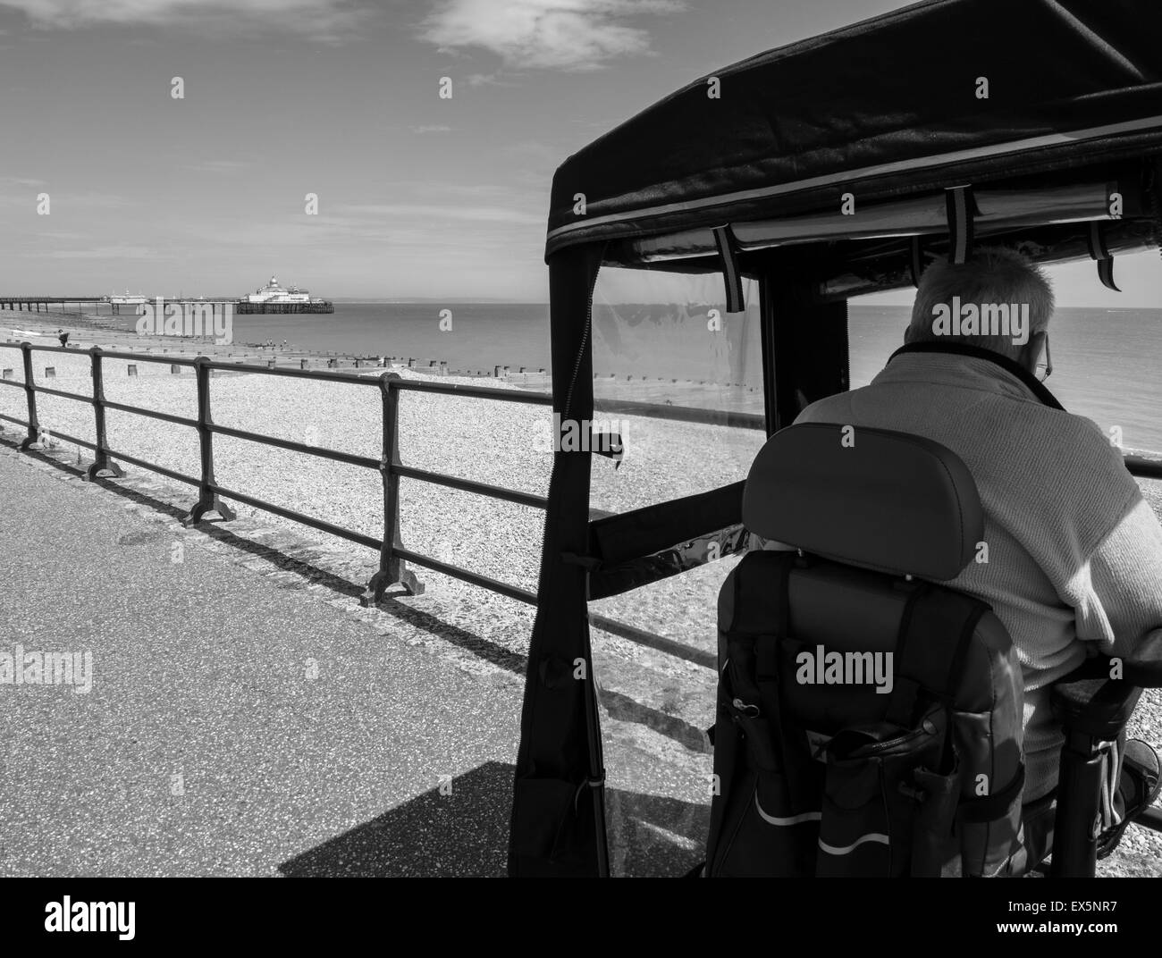 Disabled elderly man sitting in mobility cart Eastbourne promenade ...