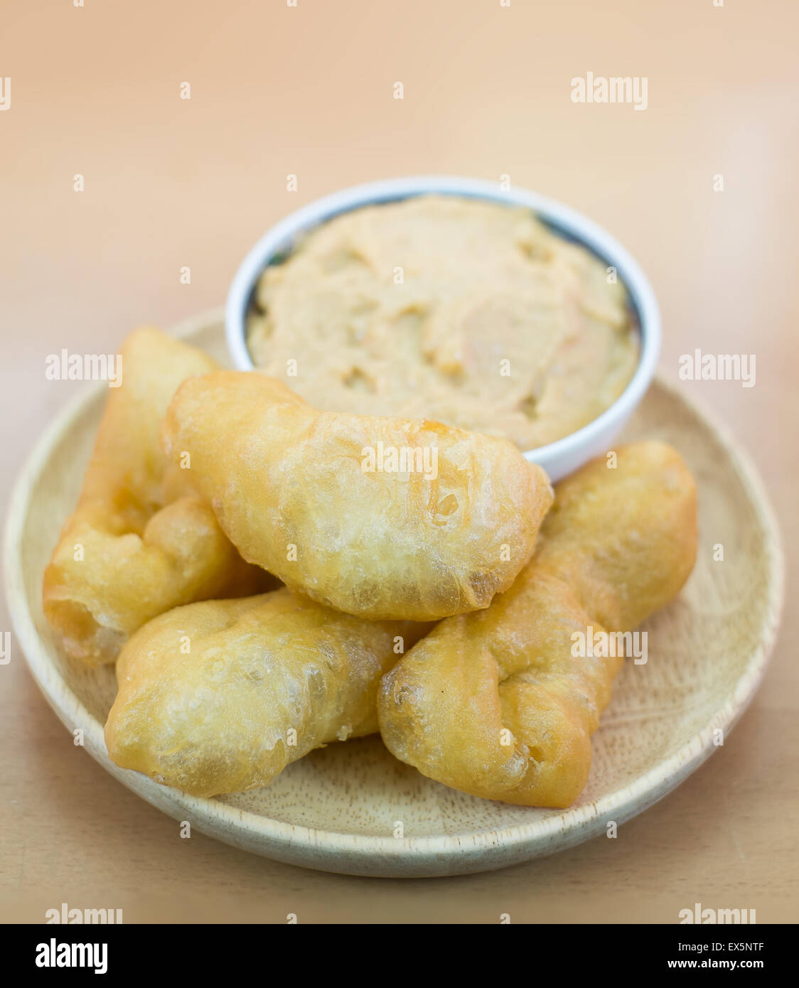 Pa Tong Go, Thai deep-fried doughsticks and egg custard Stock Photo - Alamy