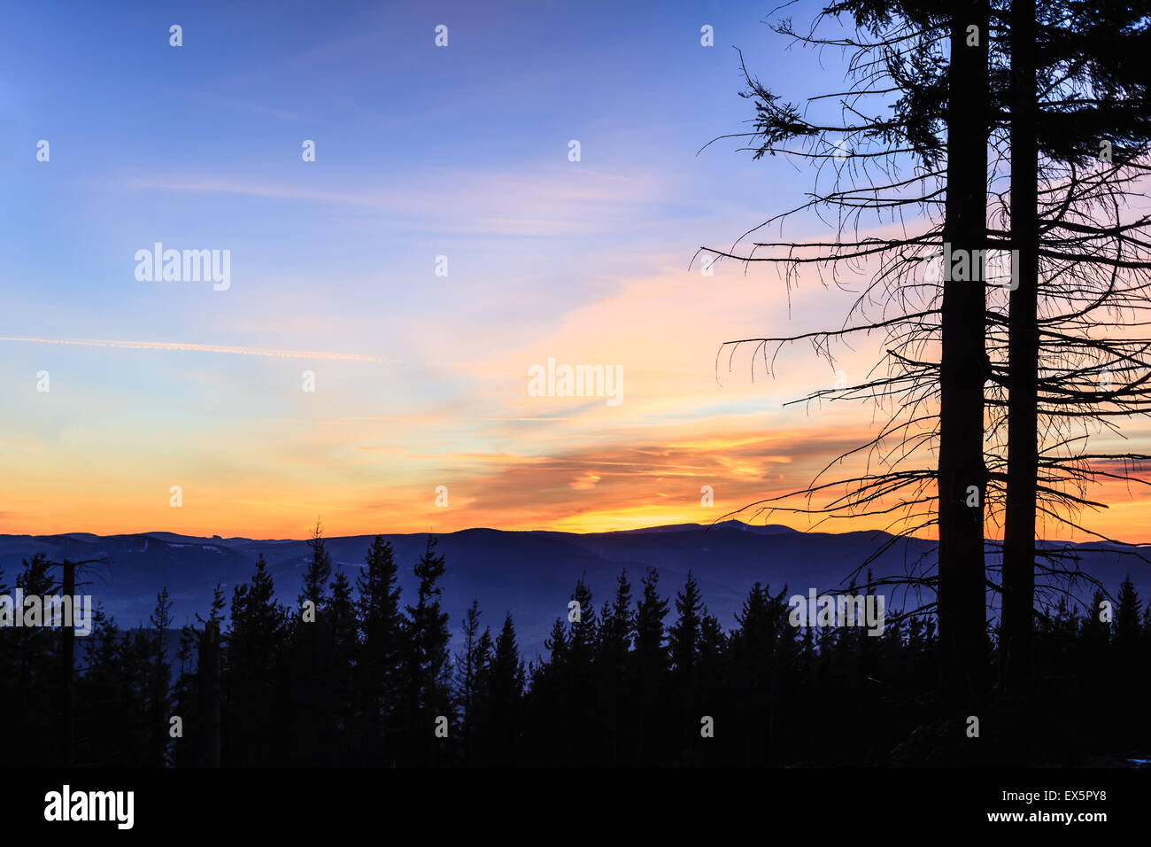 Beautiful inspirational landscape sunset in mountains. Winter hiking ...