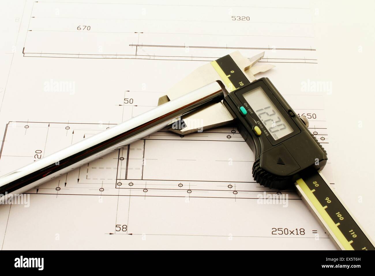 A caliber, digital, measures an object of mechanical, metal pipes Stock ...