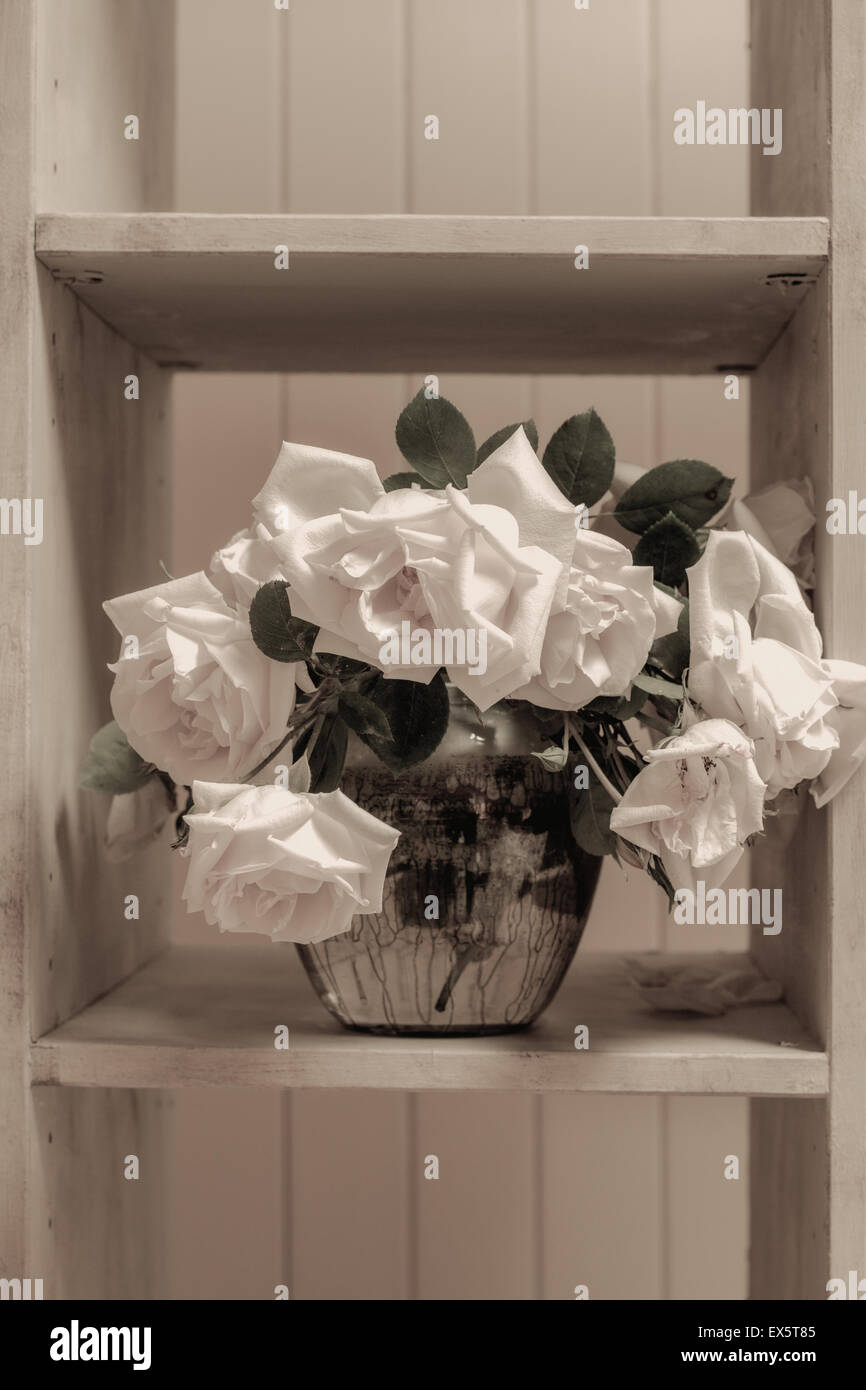 vintage roses on shelf Stock Photo - Alamy
