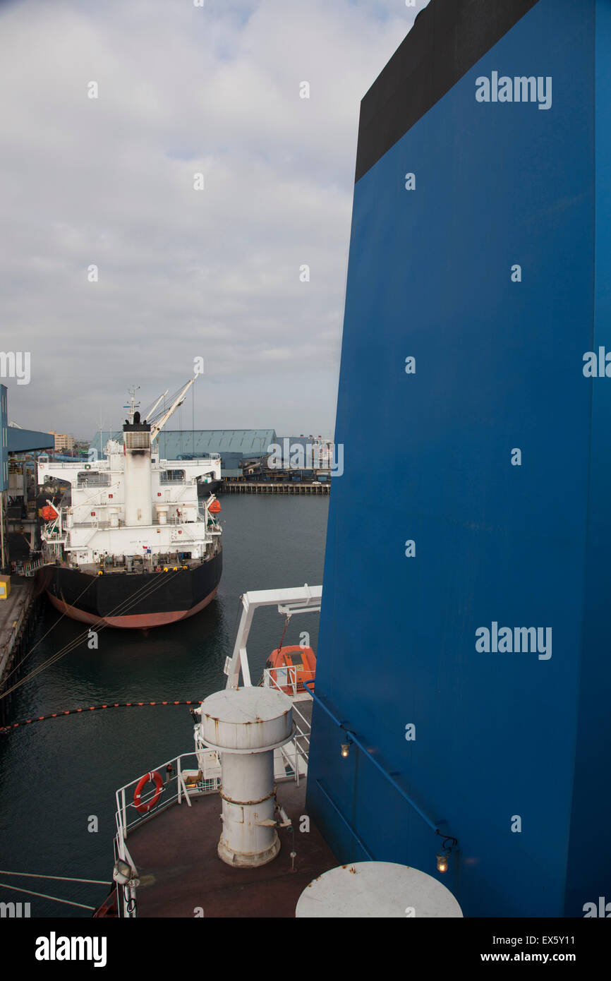 Ships docked at sunset Stock Photo - Alamy