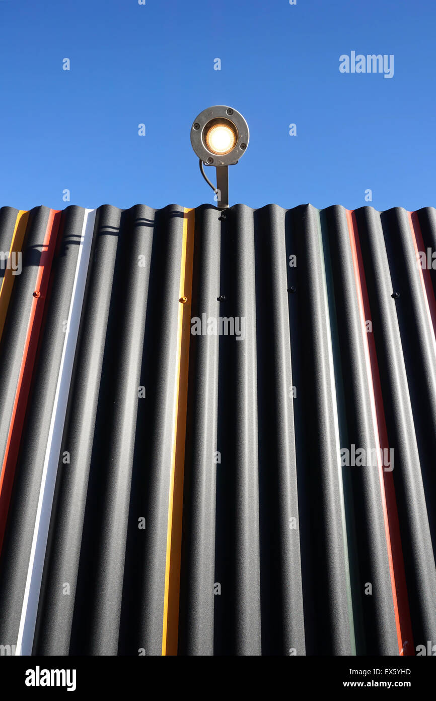 Corrugated fence with light Stock Photo - Alamy