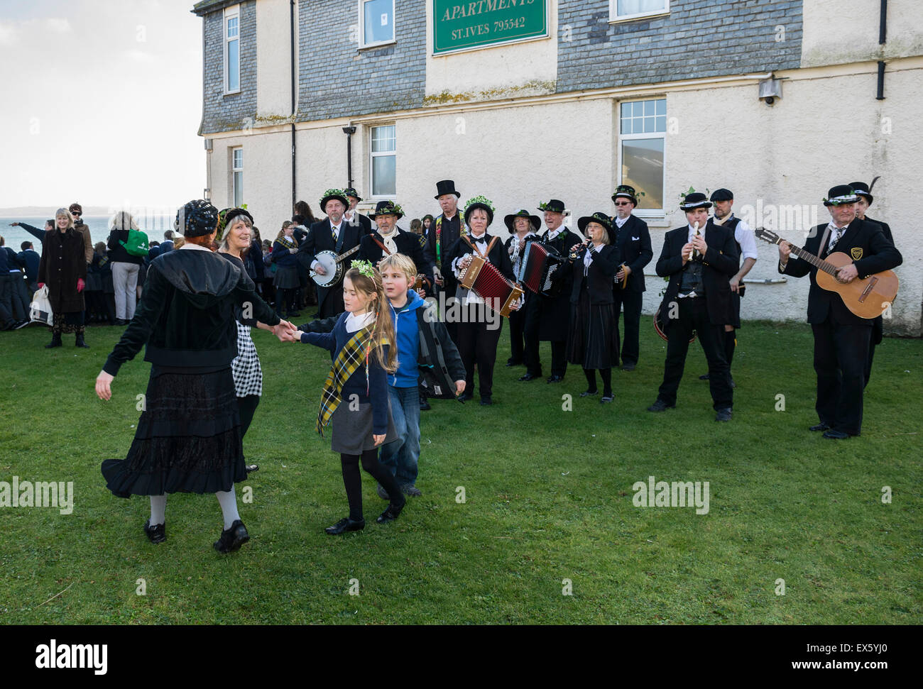 A band playing and children dancing during Feast day celebrations in St ...