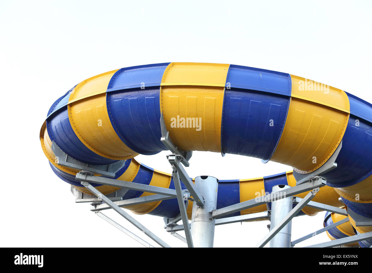 Slider in swimming pool with sky background Stock Photo - Alamy