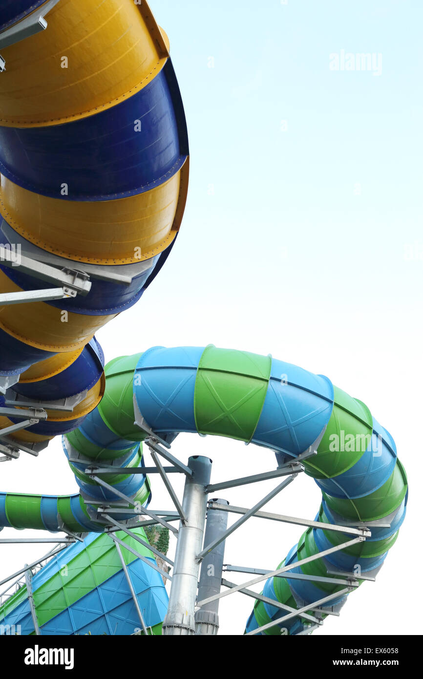 Slider in swimming pool with sky background Stock Photo - Alamy