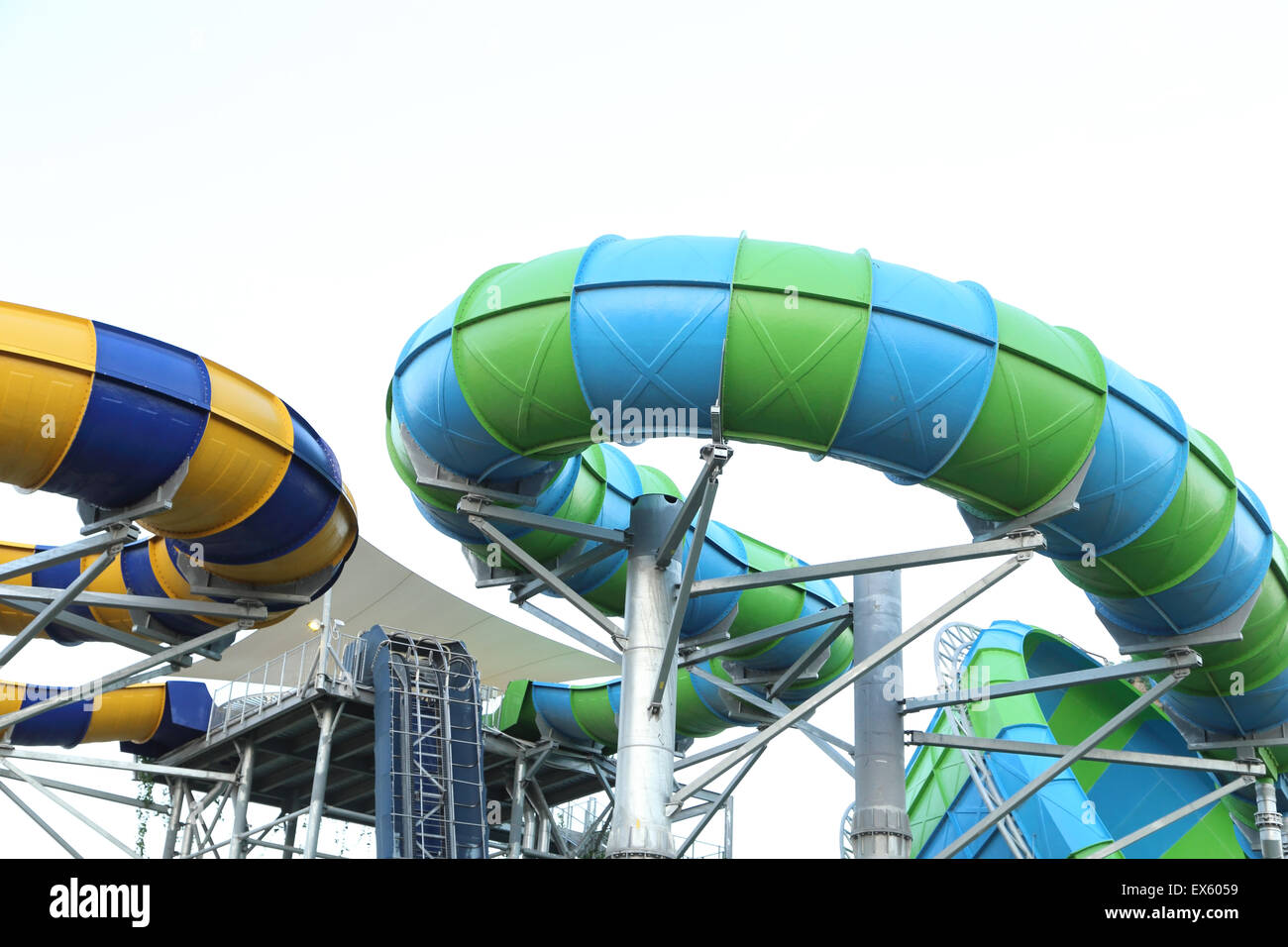 Slider in swimming pool with sky background Stock Photo - Alamy