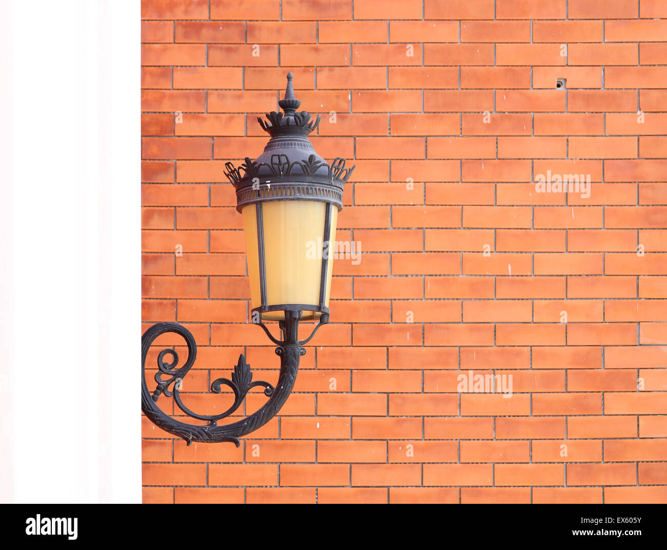 vintage lamp wall with brick wall background Stock Photo - Alamy