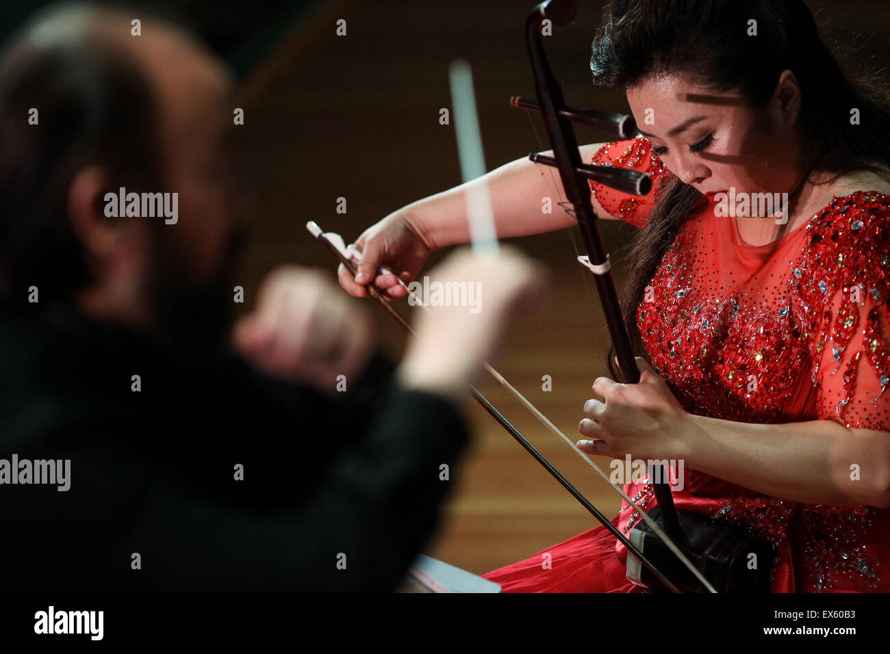 Berlin, Germany. 7th July, 2015. A Chinese erhu artist performs during ...