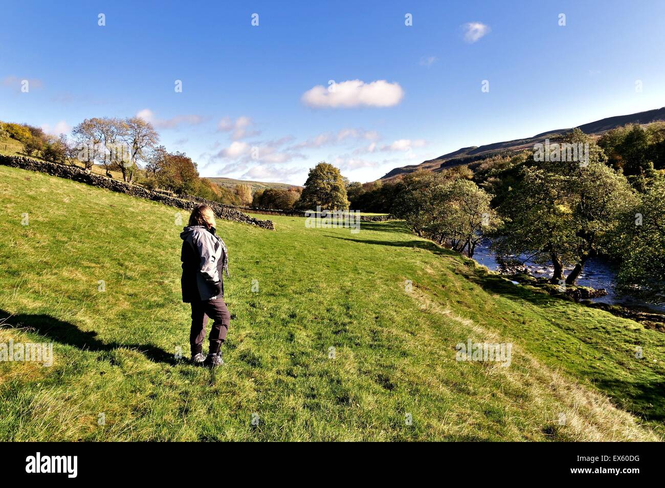 Single female rambler in Muker Swaledale Yorkshire Stock Photo - Alamy