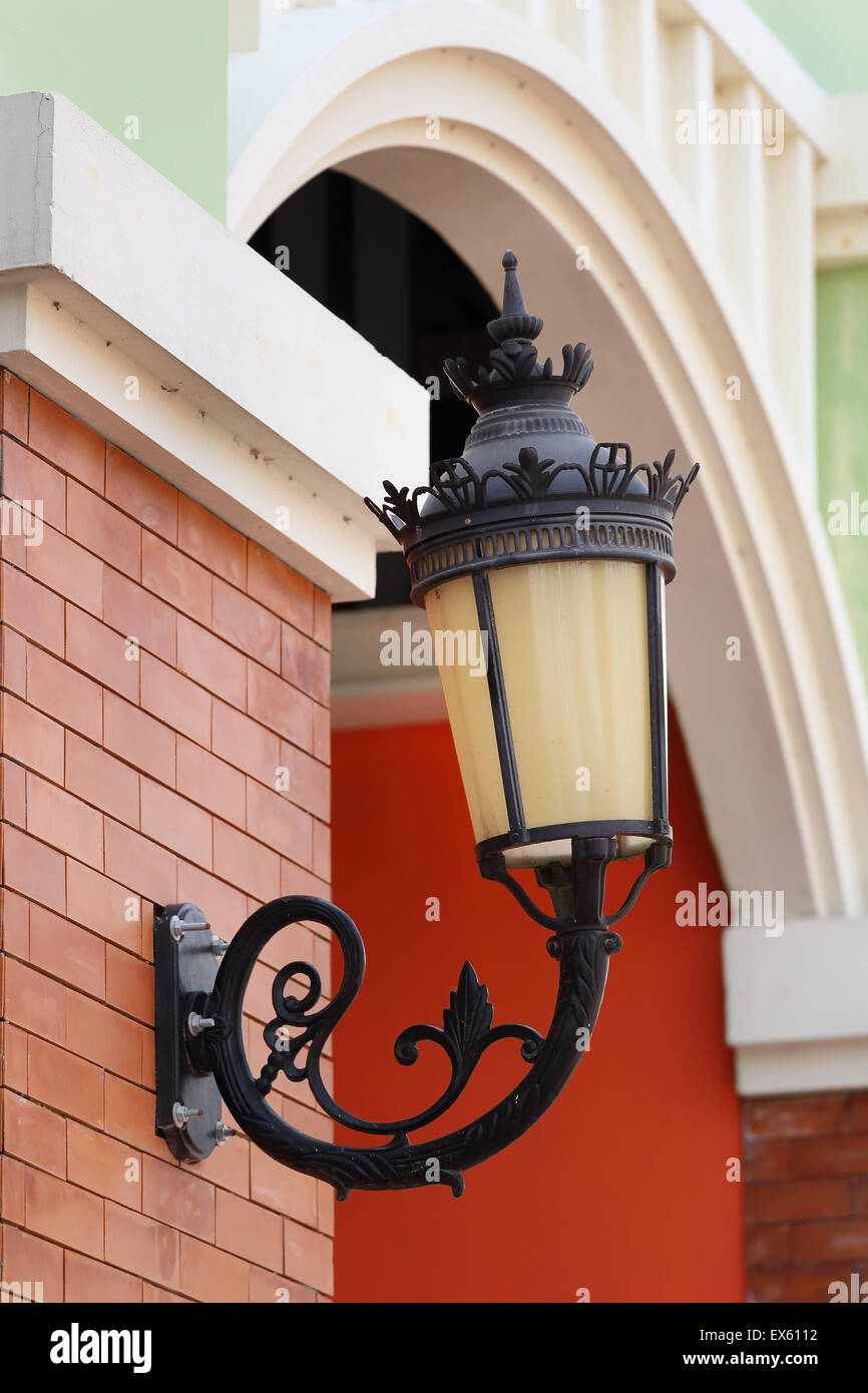 vintage lamp wall with a wall background Stock Photo - Alamy
