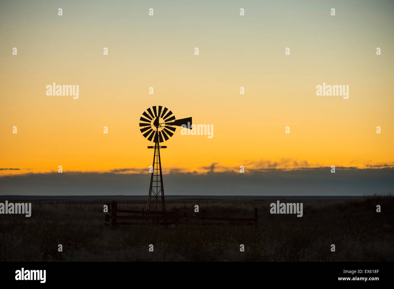 rural landscape with windmill in eastern Colorado at sunset Stock Photo ...