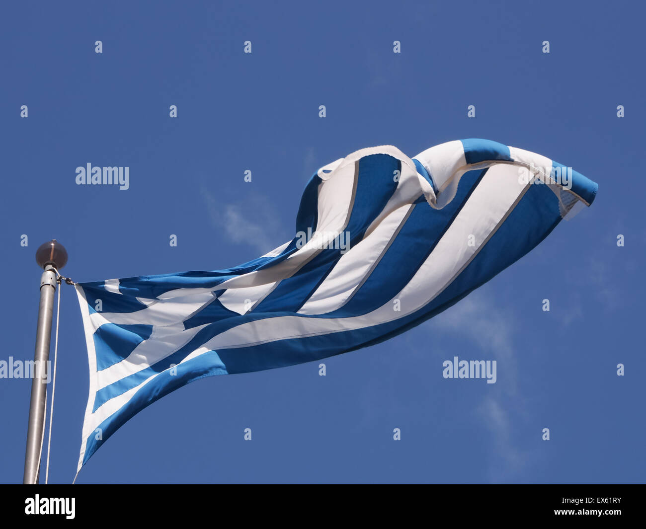 A greek flag flying on the top of a flag pole Stock Photo - Alamy