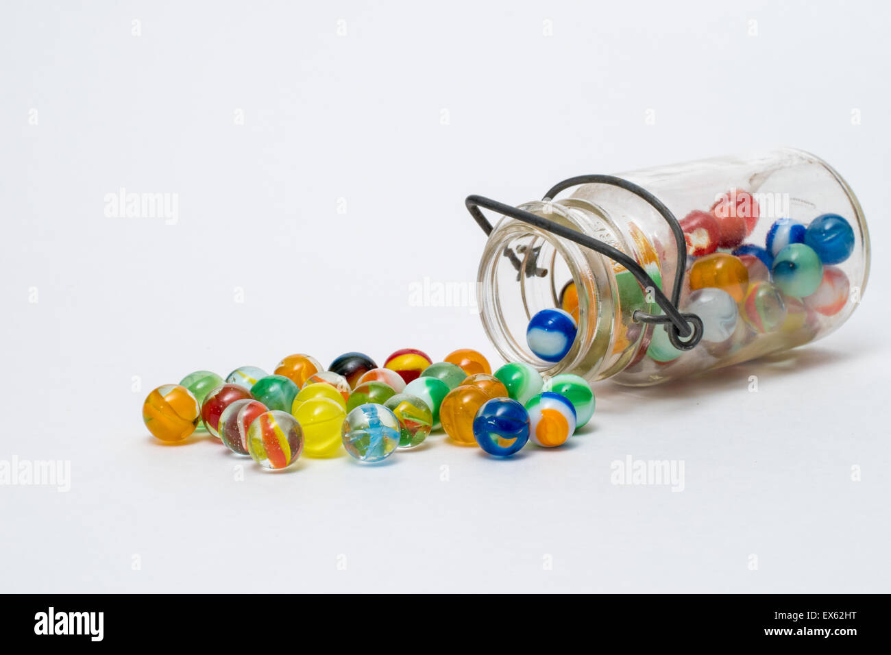 Colorful Spilled Marbles Glass Jar Metal Wire on White Background Stock ...