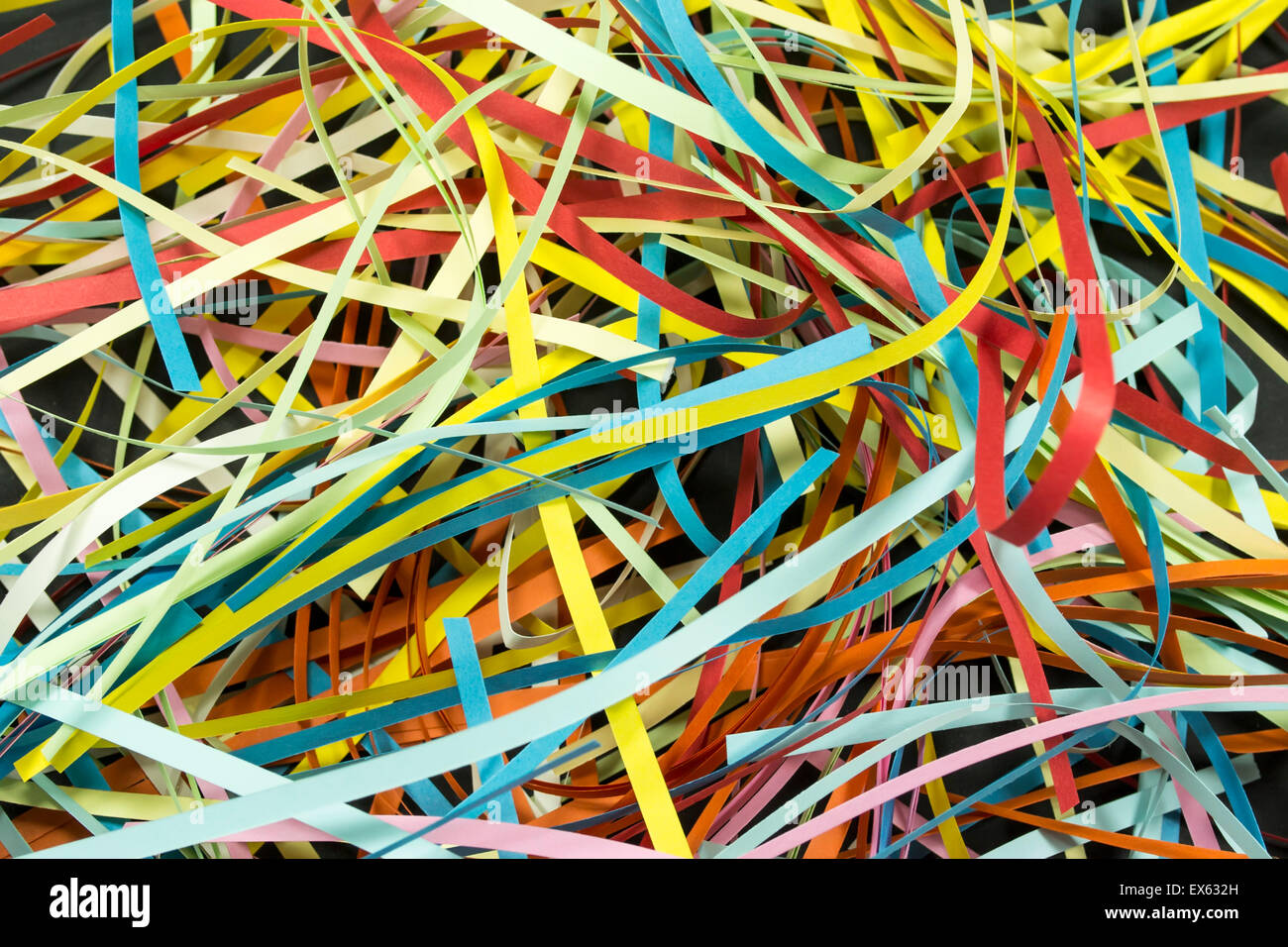 Colored thin paper ribbons tangled forming a background Stock Photo - Alamy