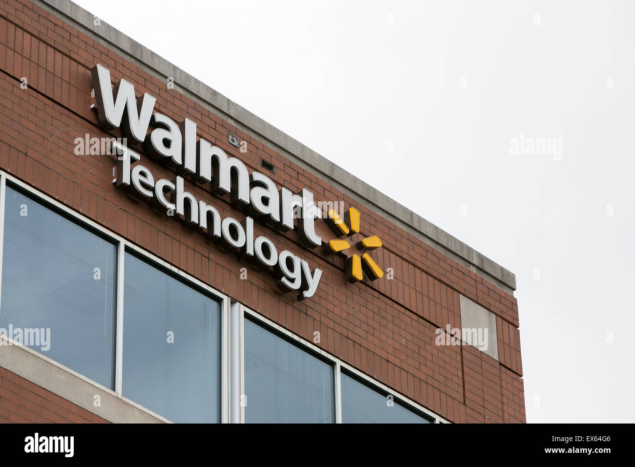 A logo sign outside of an office building occupied by Walmart ...