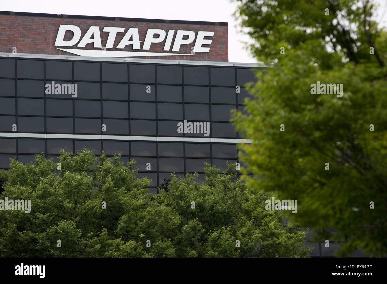A logo sign outside of an office building occupied by Datapipe in ...
