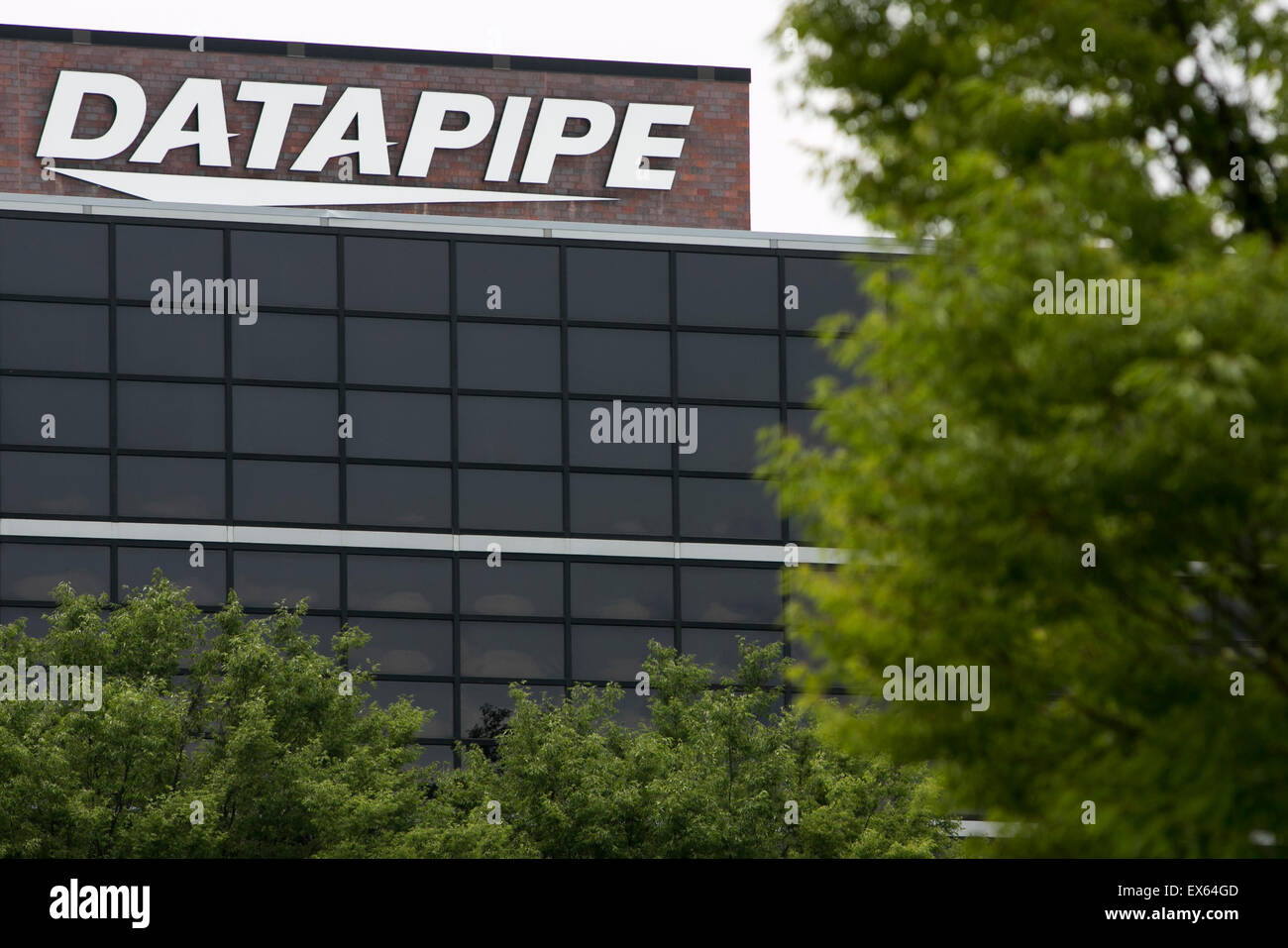 A logo sign outside of an office building occupied by Datapipe in ...