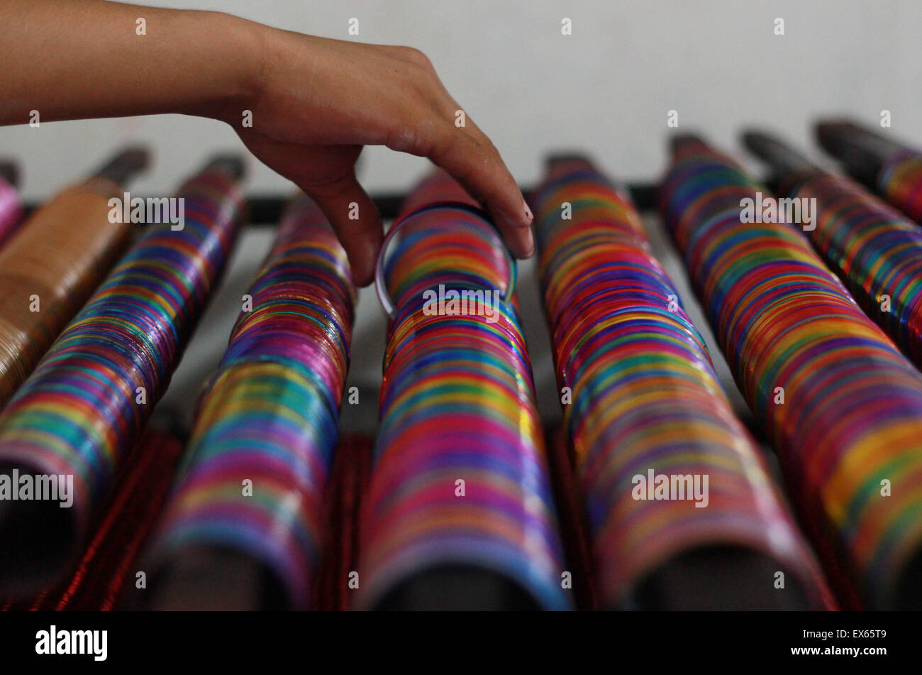 Lahore, Pakistan. 07th July, 2015. Pakistani worker is busy preparing ...