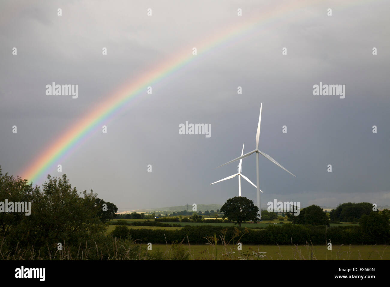 Rainbow over wind turbines Stock Photo - Alamy