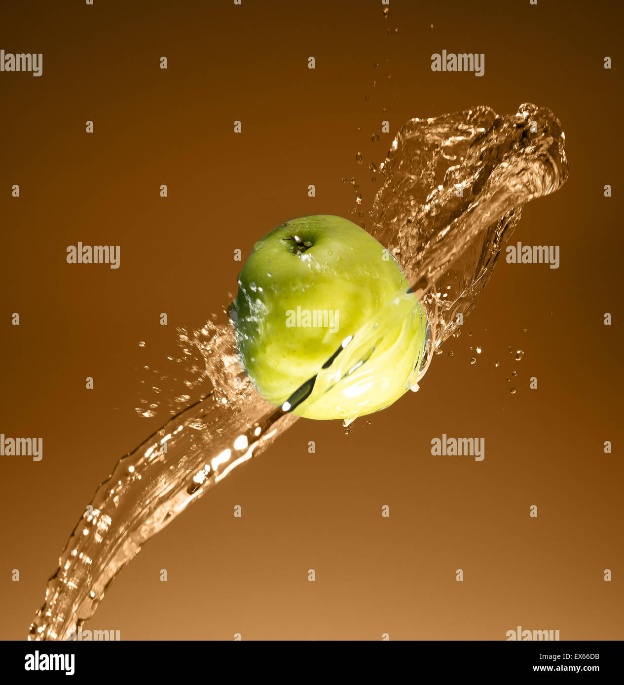 Green apple with water splash on beige background Stock Photo - Alamy