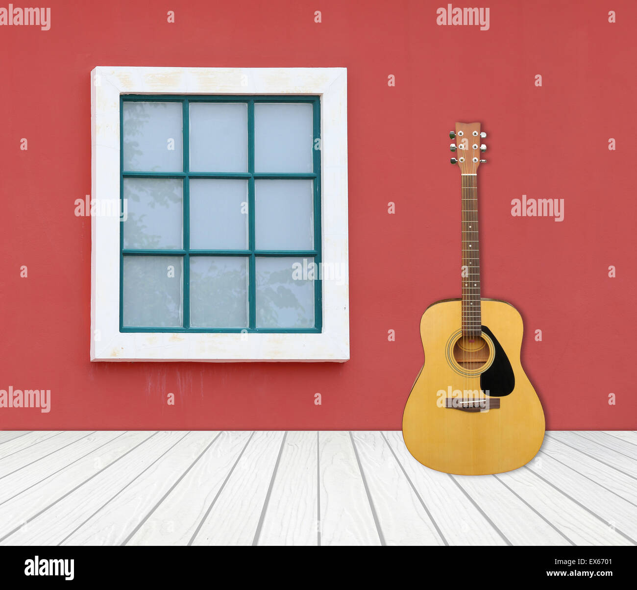 Guitar with window on cement wall and wood wall Stock Photo - Alamy