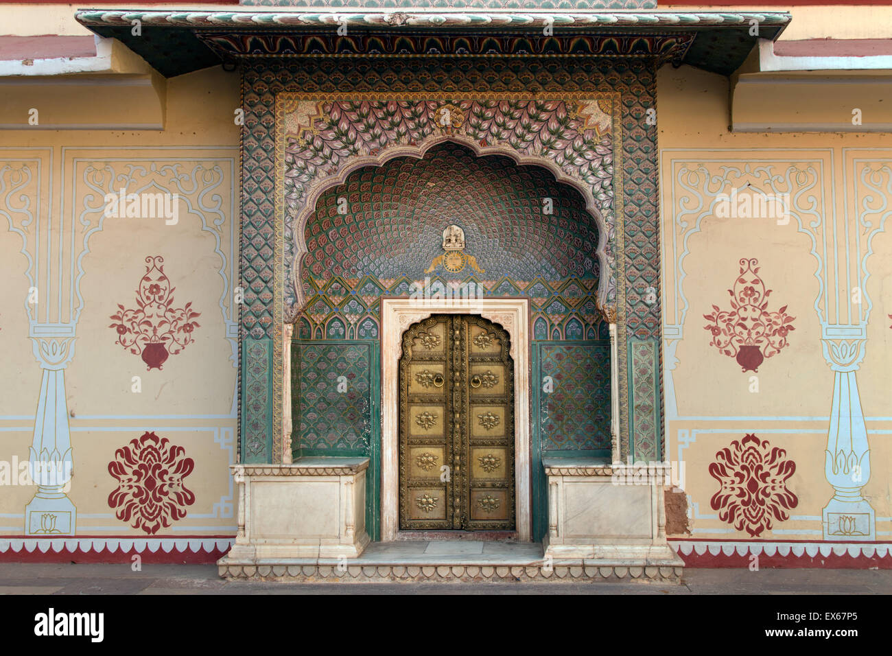 Brass gate with delicate wall paintings in the courtyard of the Chandra ...