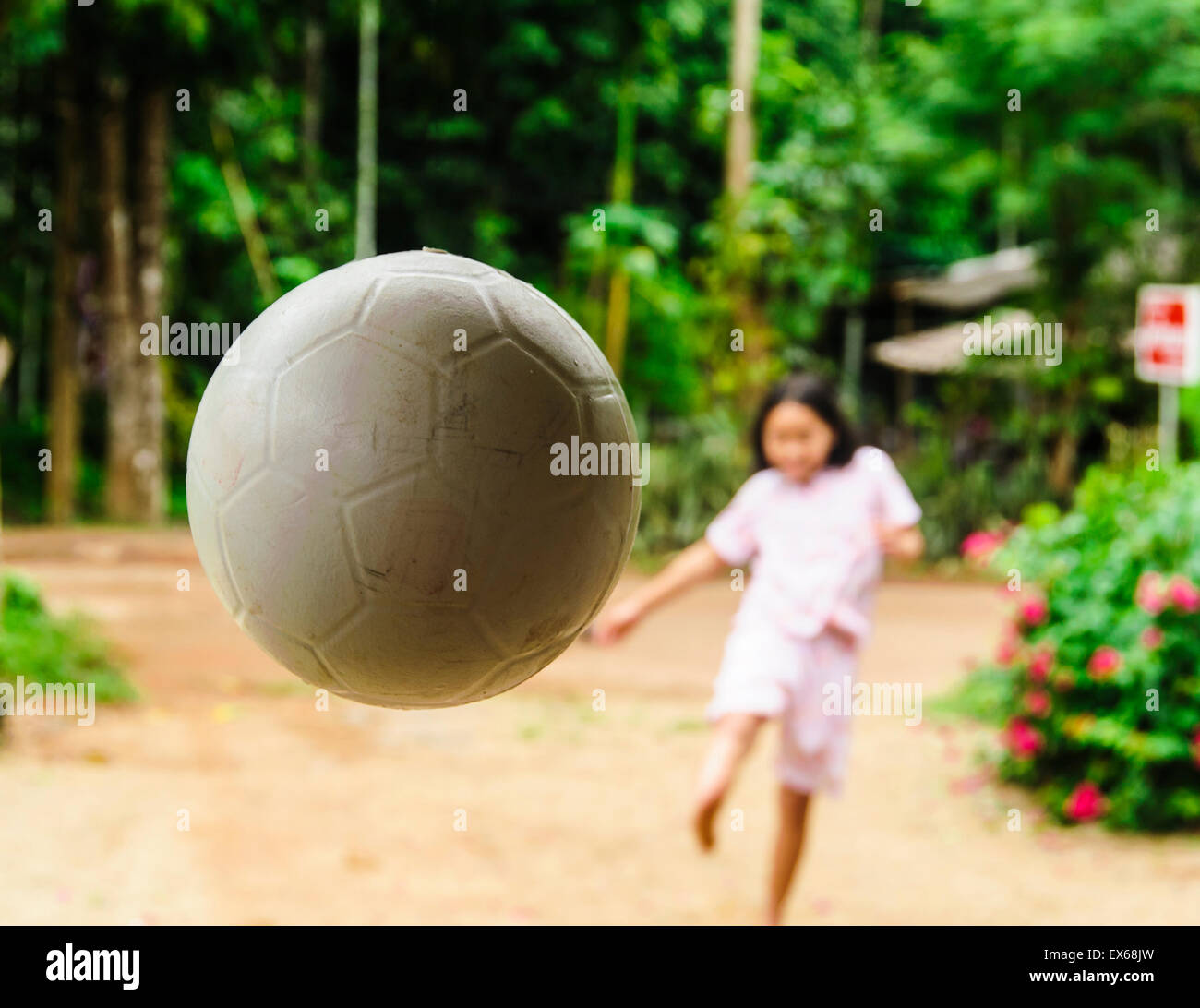 Action shots, Stop ball from girl kick Stock Photo - Alamy