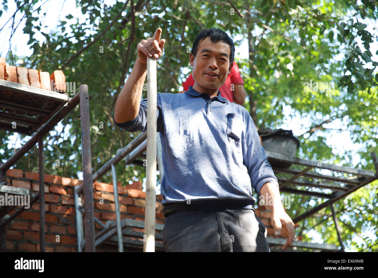 Bricklayers at construction site Stock Photo - Alamy