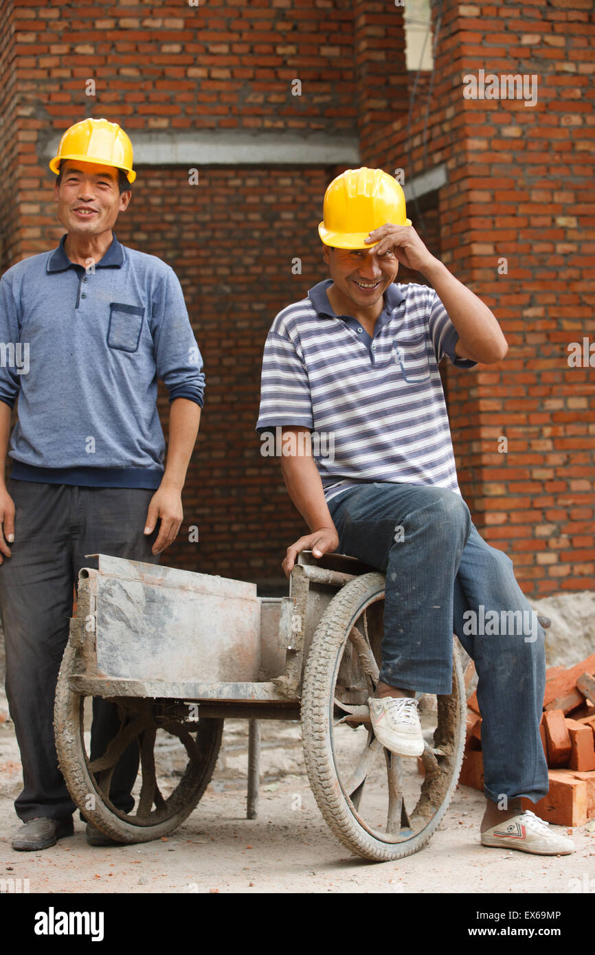 Portrait of two construction workers Stock Photo - Alamy