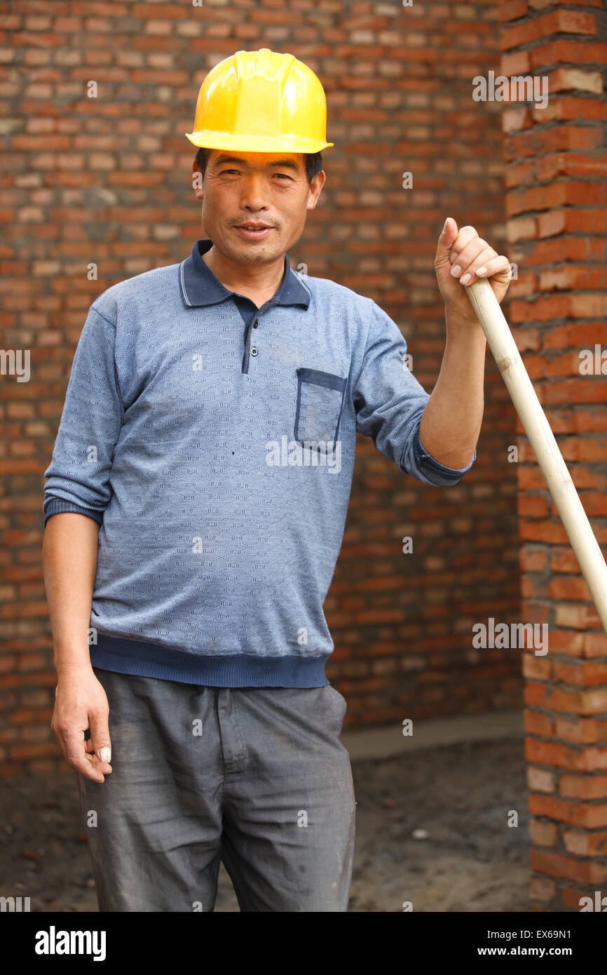 Bricklayers at construction site Stock Photo - Alamy