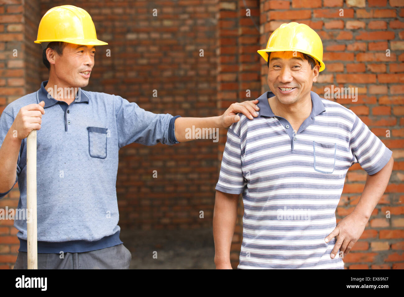 Portrait of two construction workers Stock Photo - Alamy