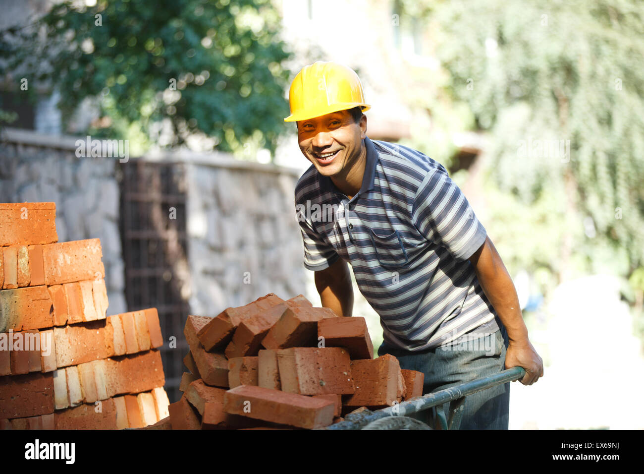 Bricklayers at construction site Stock Photo - Alamy