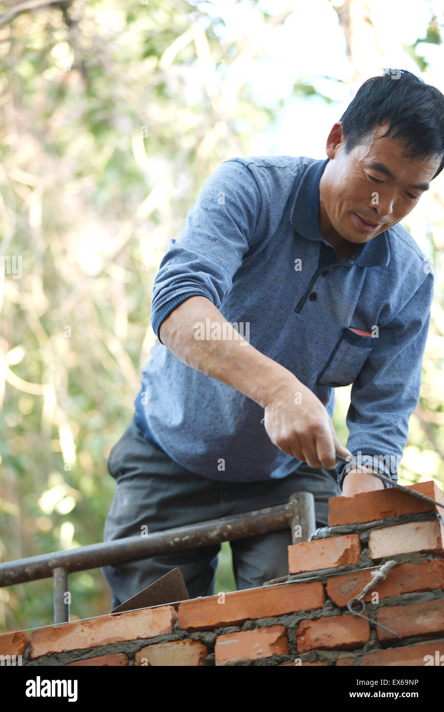 Bricklayers at construction site Stock Photo - Alamy