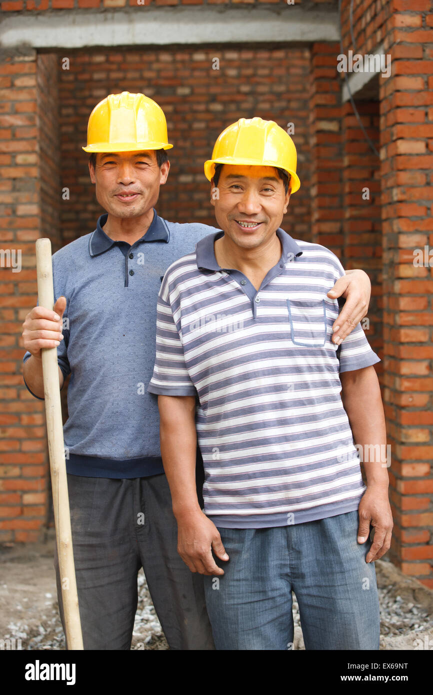 Portrait of two construction workers Stock Photo - Alamy