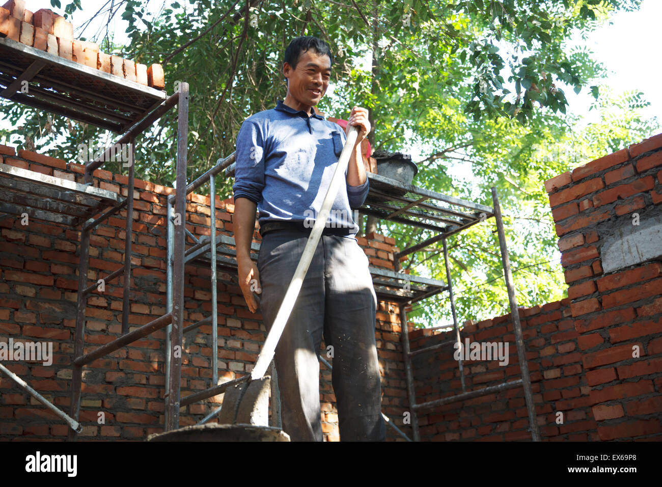 Bricklayers at construction site Stock Photo - Alamy