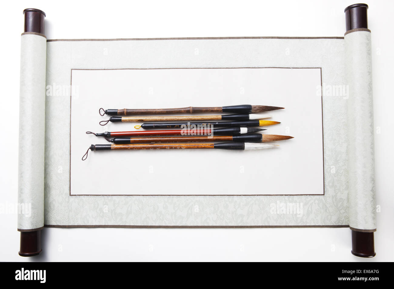Still life scroll and calligraphy brush Stock Photo - Alamy