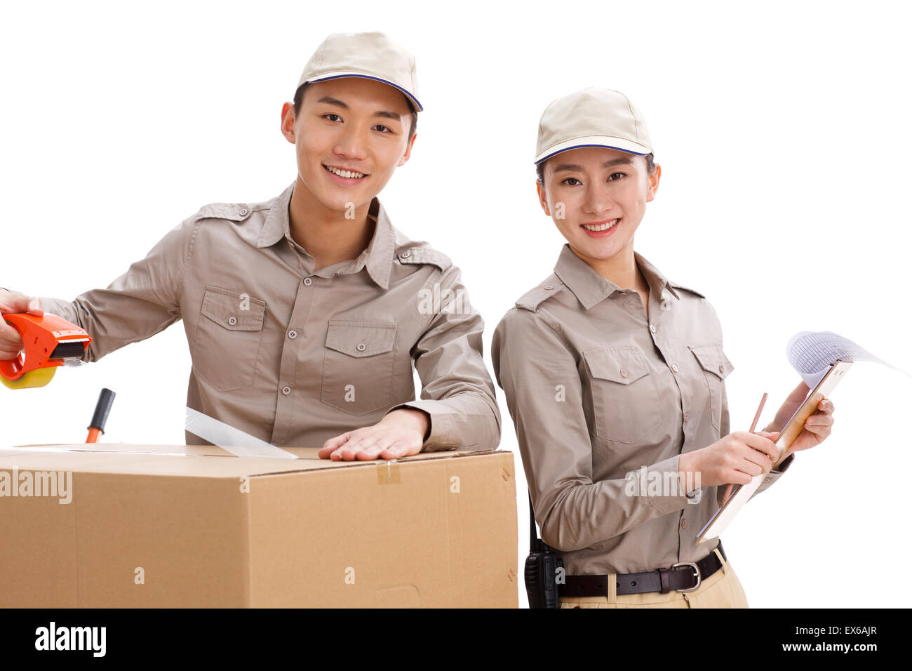Young man packing cardboard boxes Stock Photo - Alamy