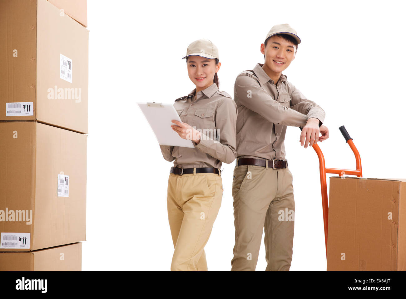 Portrait of young woman and young man with push cart Stock Photo - Alamy