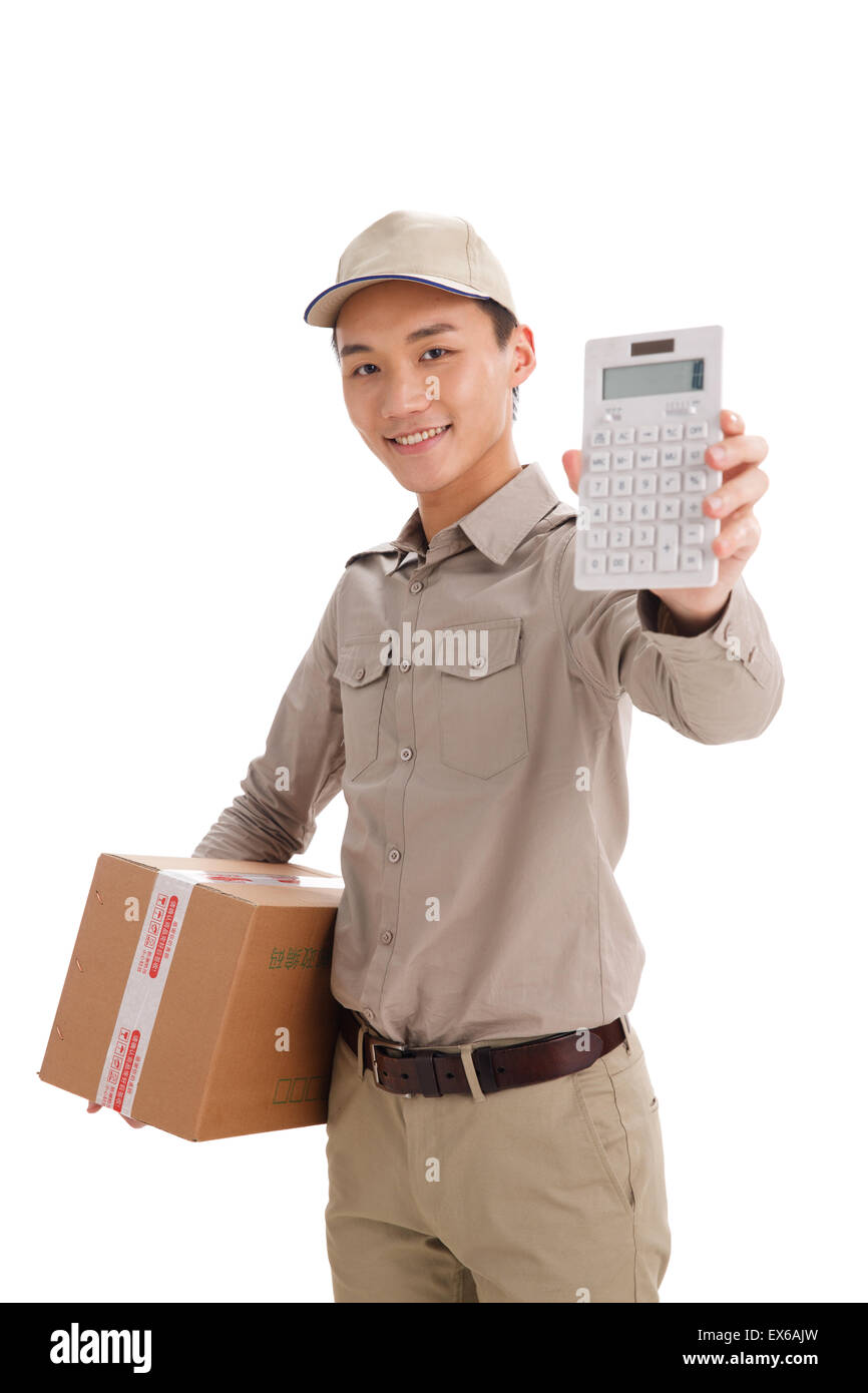 Portrait of young man holding package Stock Photo - Alamy
