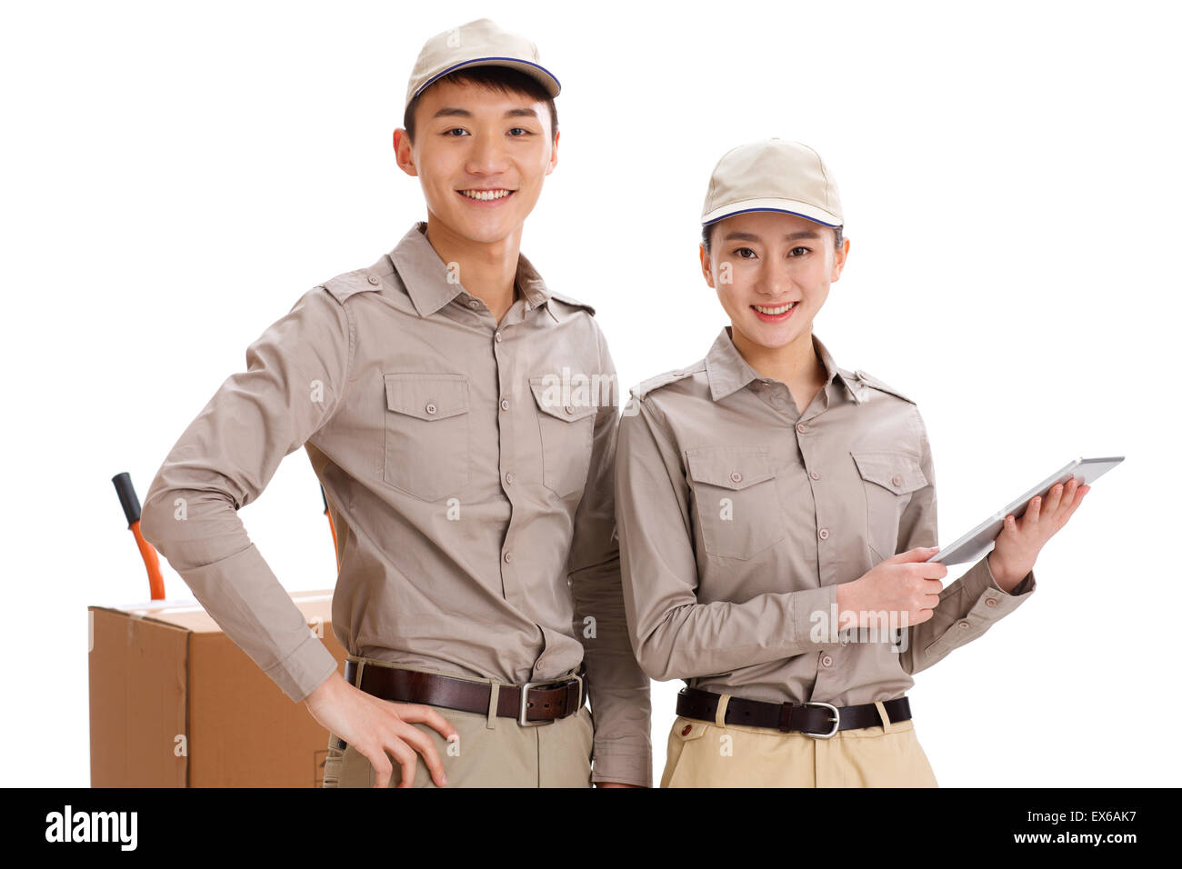 Portrait of young woman and young man with push cart Stock Photo - Alamy