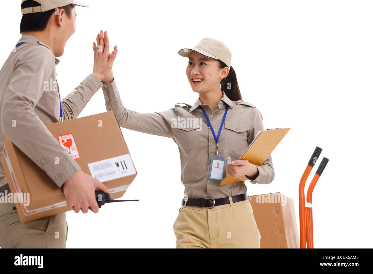 Young woman and young man clapping hands Stock Photo - Alamy