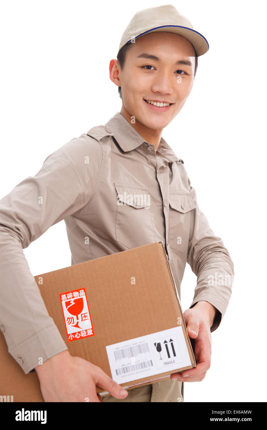 Portrait of young man holding package Stock Photo - Alamy