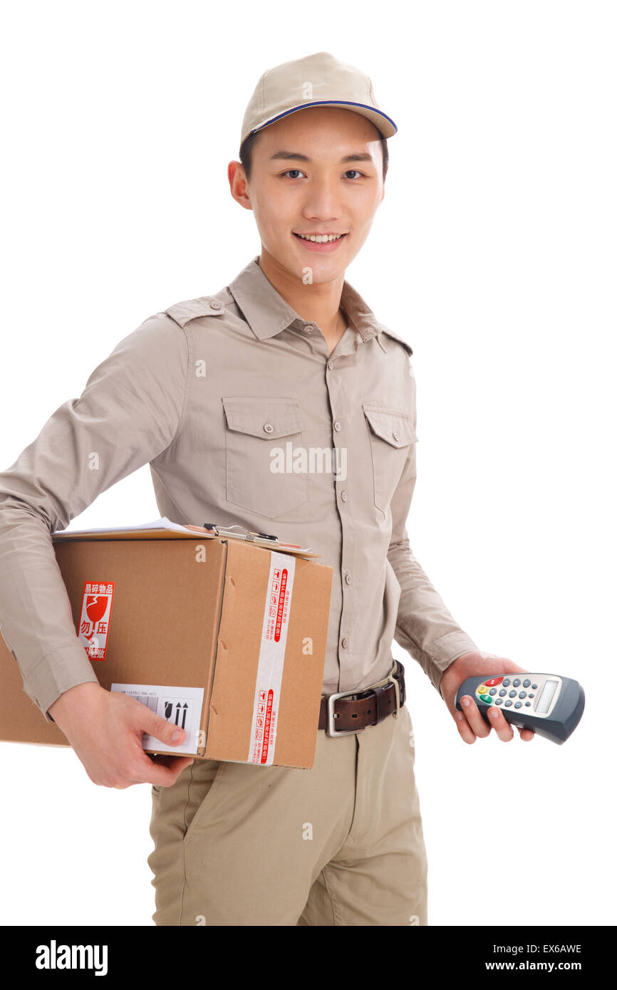 Portrait of young man holding package Stock Photo - Alamy