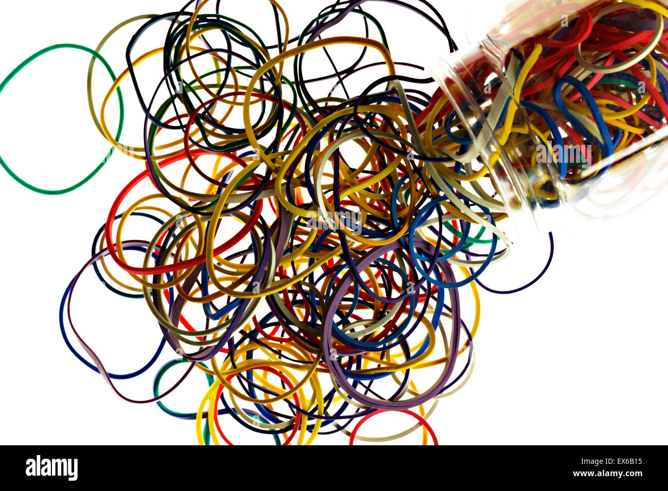 Coloured elastic rubber bands and container on white background Stock ...