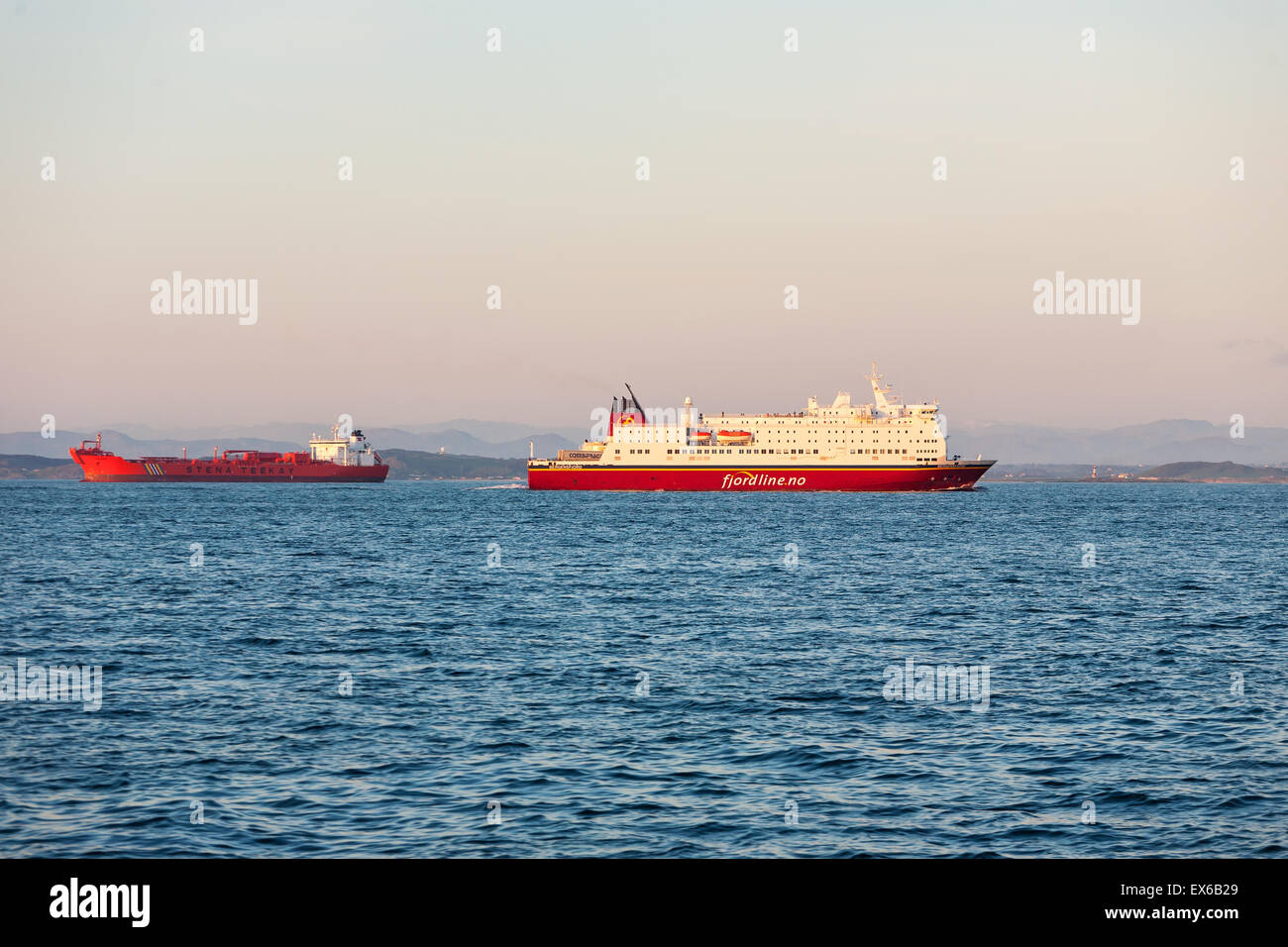 Ferry and cargo ship at sea Stock Photo - Alamy