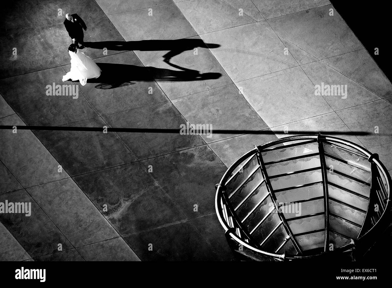 Wedding couple casting shadow Stock Photo - Alamy