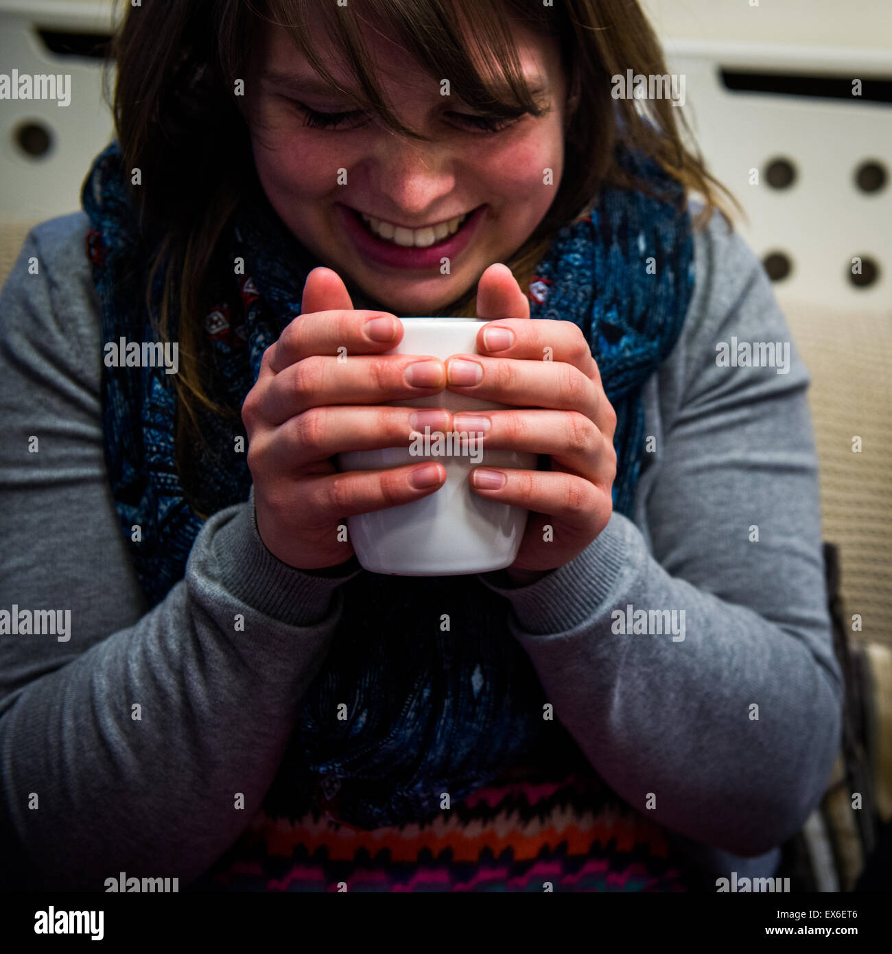 Girl drinking cup of tea and talking Stock Photo - Alamy