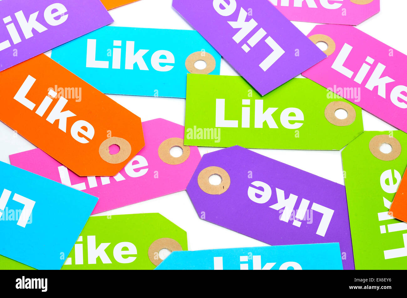 a pile of paper labels of different colors with the word like written ...